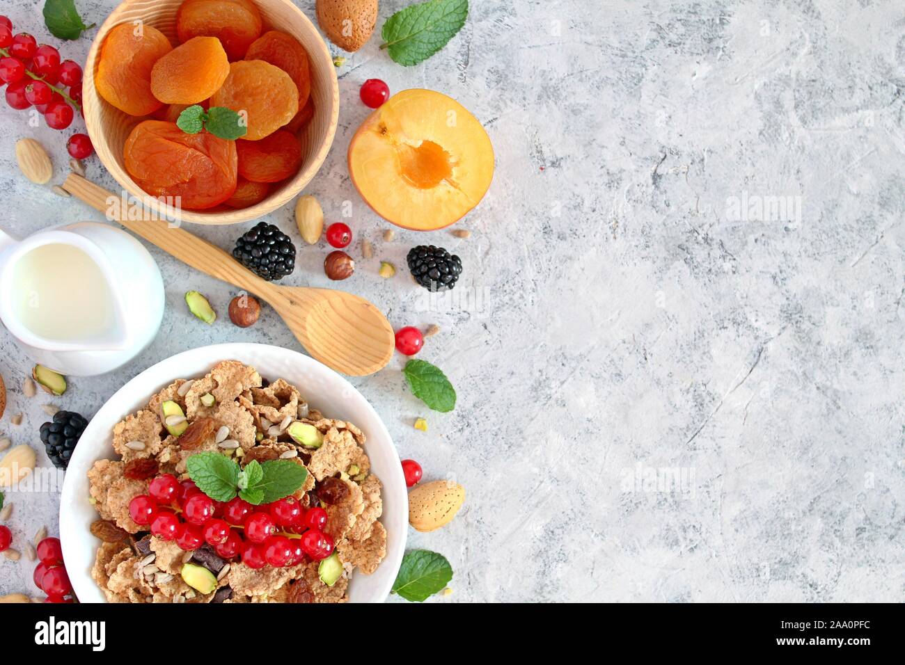 Healthy breakfast ingredients on light background. Top view with copy ...