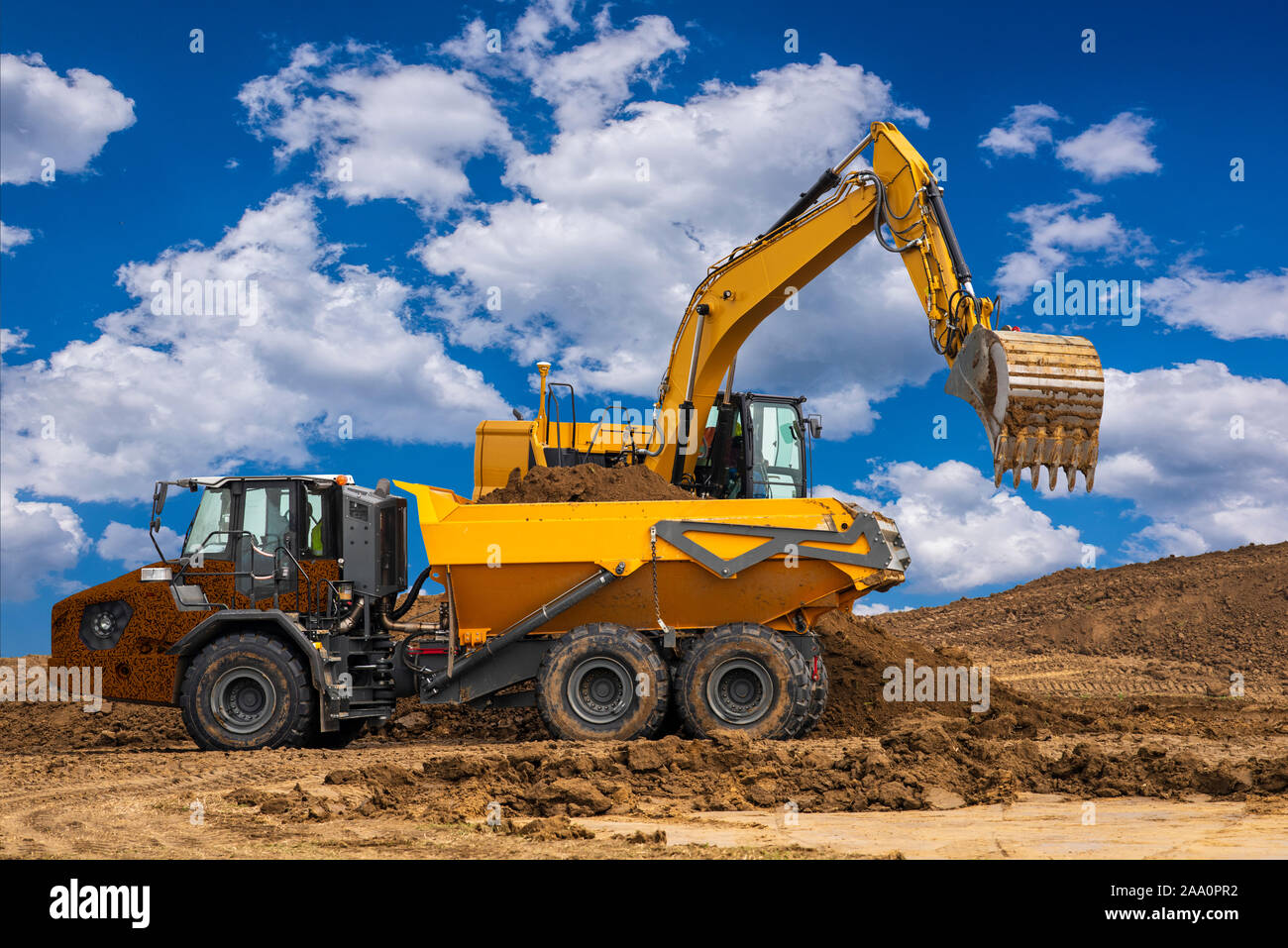 Excavator on a construction site Stock Photo - Alamy
