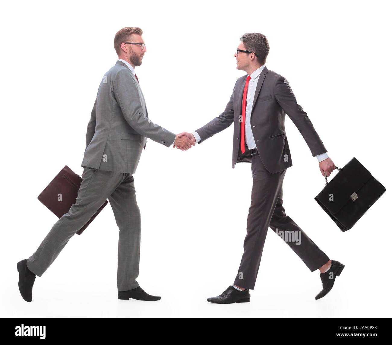 in full growth. walking business men shaking hands Stock Photo - Alamy