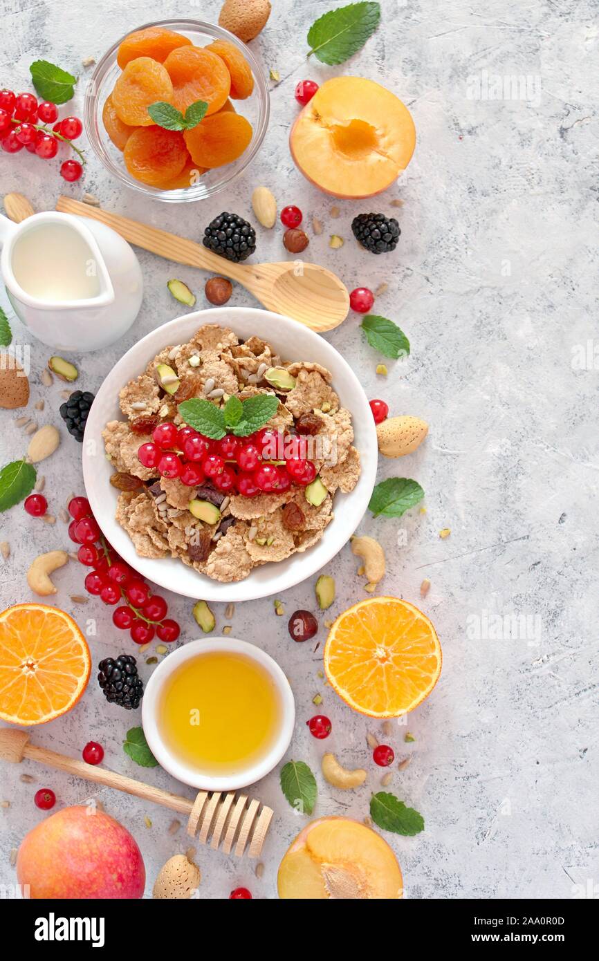 Healthy breakfast ingredients on light background. Top view with copy ...