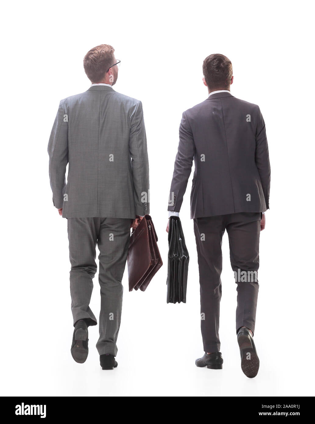 rear view. two business men walking together Stock Photo - Alamy