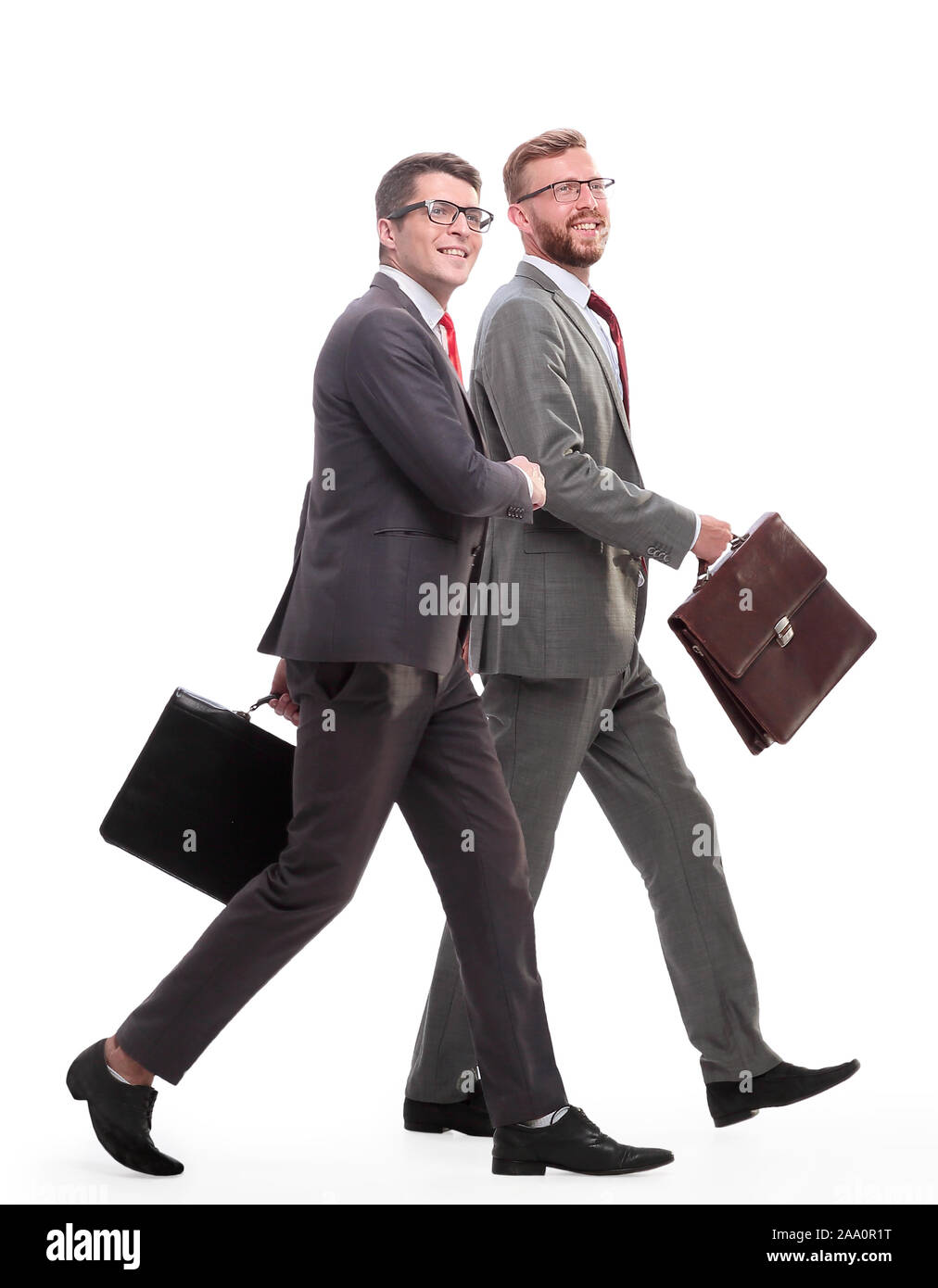 Two people walking side by side Cut Out Stock Images & Pictures - Alamy
