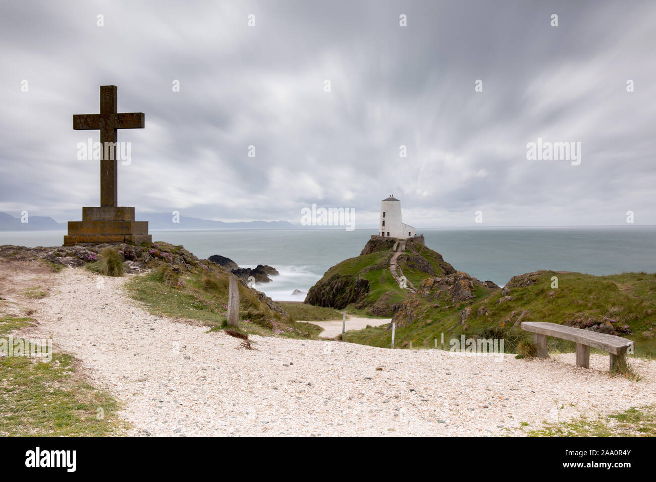 Llanddwyn Island Lighthouse, and cross, Anglesey, North Wales, UK Stock ...