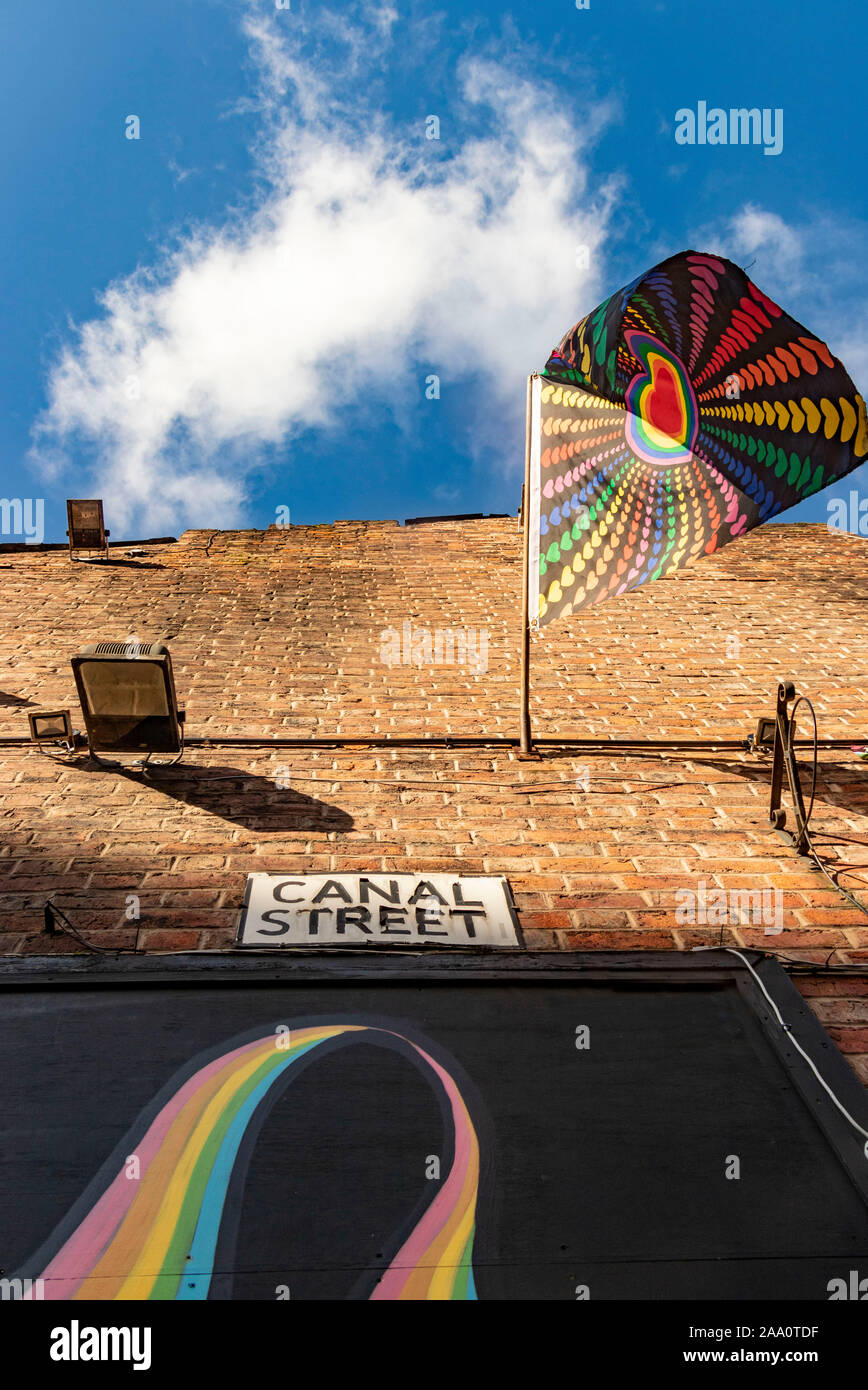 gay rainbow flag flying in Canal street in Manchester UK Stock Photo ...