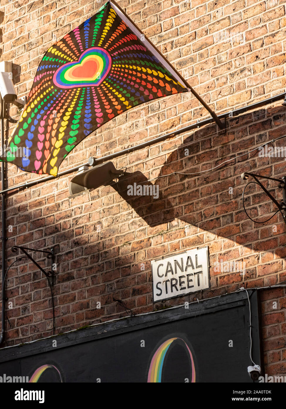 gay rainbow flag flying in Canal street in Manchester UK Stock Photo ...