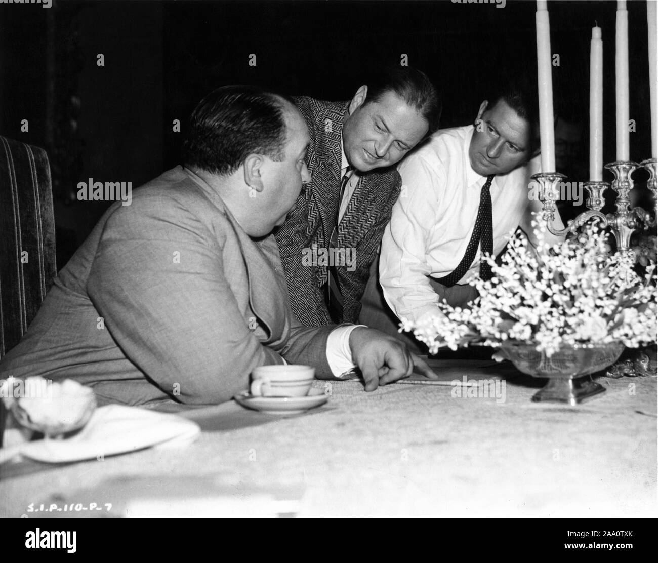 Director ALFRED HITCHCOCK and his assistants ERIC STACEY and REGGIE ...
