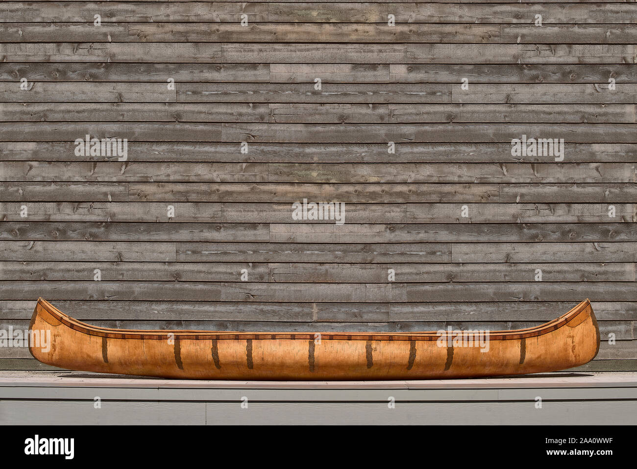 old wooden kayak Indian style, on wooden background, in Canada Stock ...