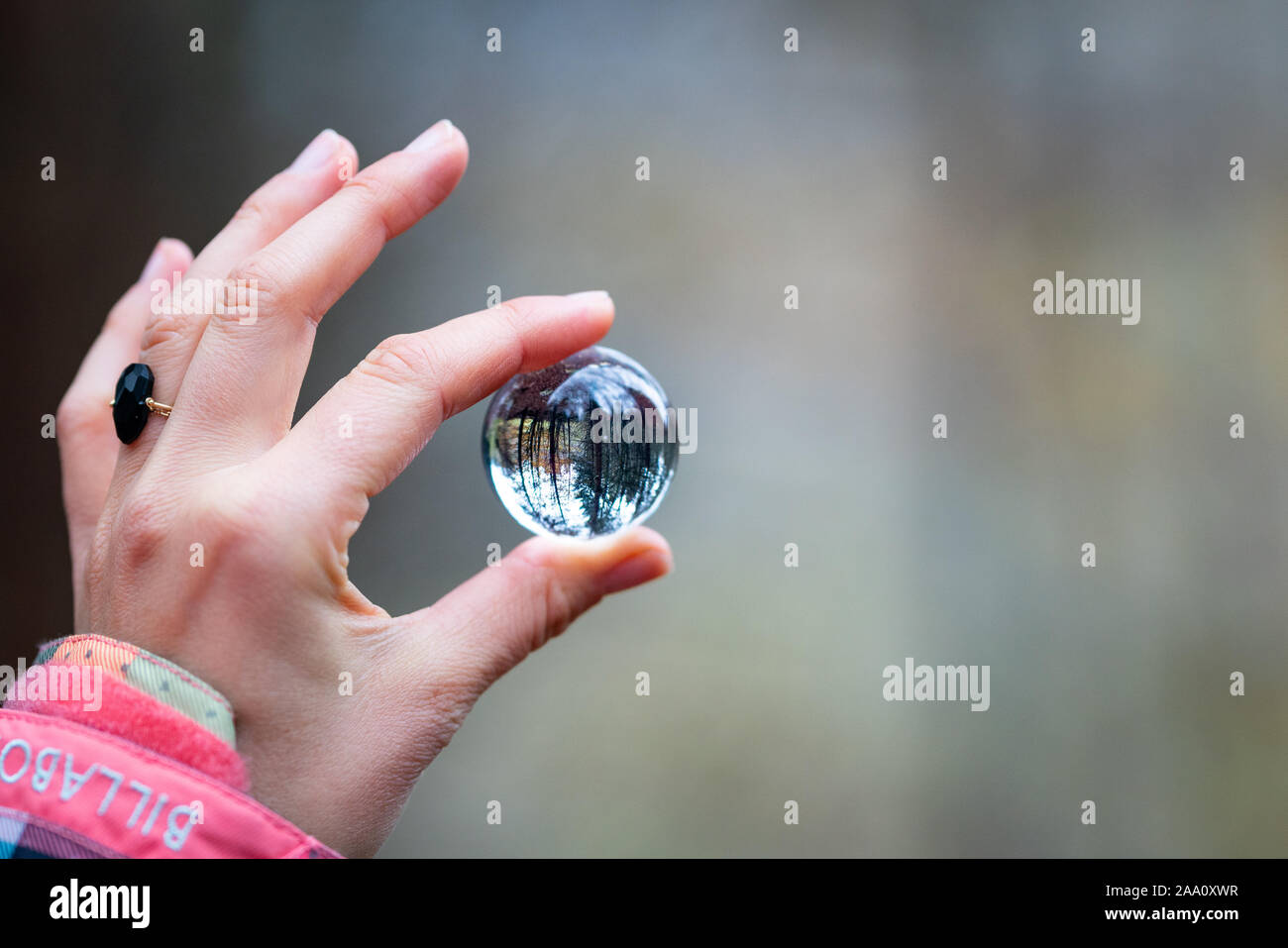 Glass sphere in the hand Stock Photo - Alamy