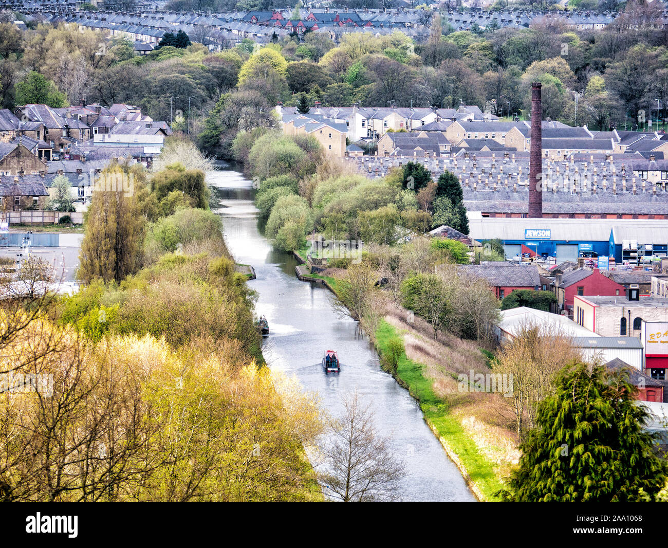 Narrowboat travelling along the Burnley Embankment on the Leeds and ...