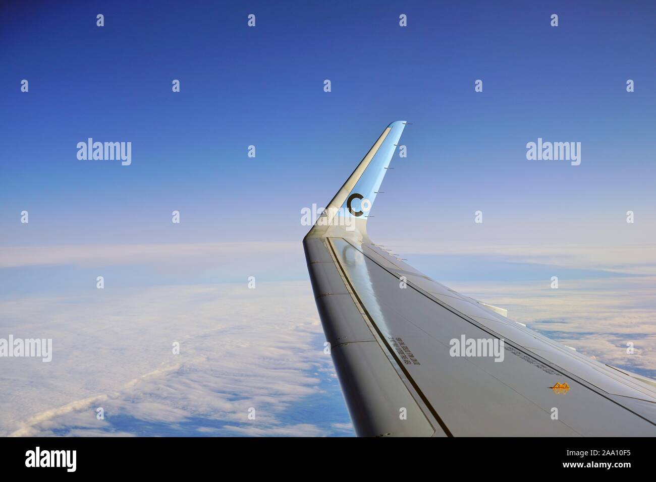 ORLY, FRANCE -16 NOV 2019- Sky view of the blue and white winglet of an ...