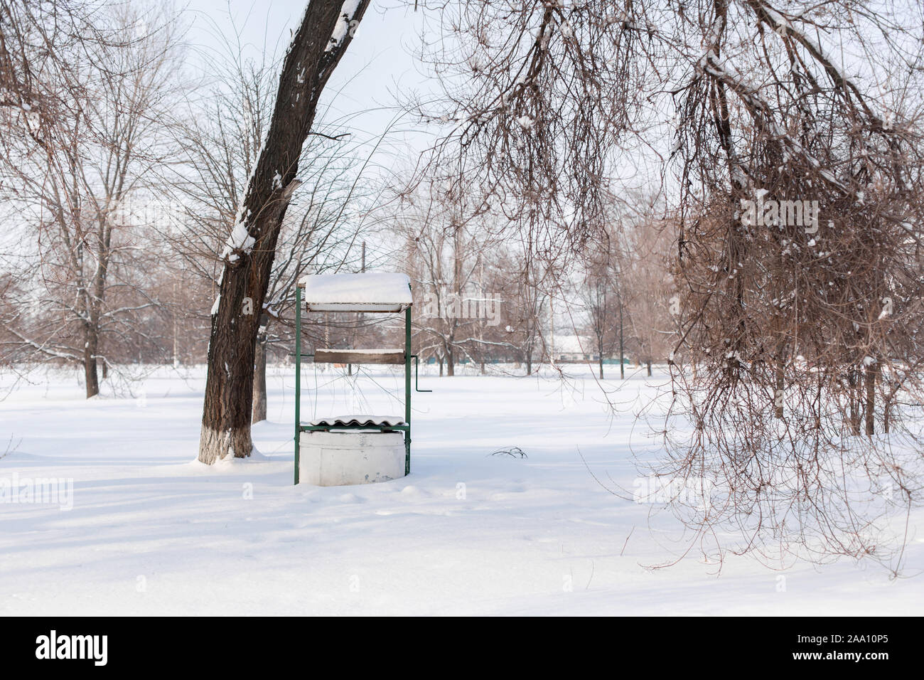 Winter. An old water well is covered in snow Stock Photo - Alamy