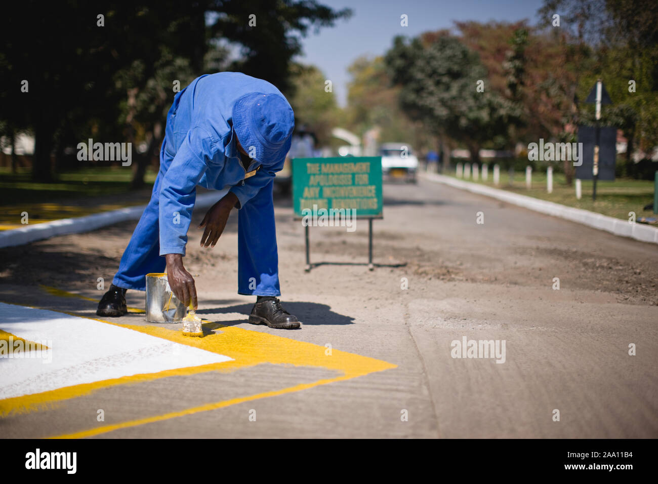 Man painting road markings Stock Photo - Alamy