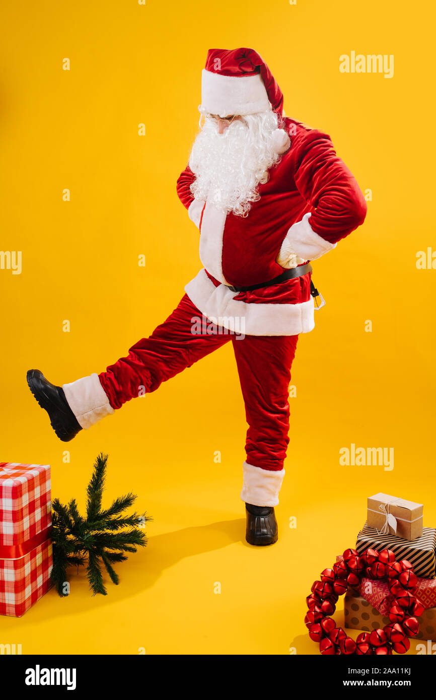 Cheerful Santa Claus in a funny pose, studio shot Stock Photo - Alamy