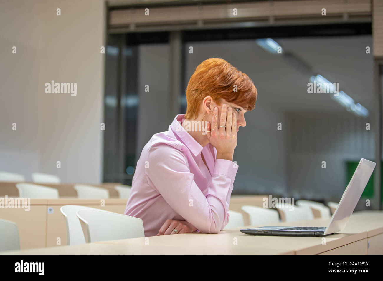 Young beautiful woman on a university lecture working on a laptop Stock ...