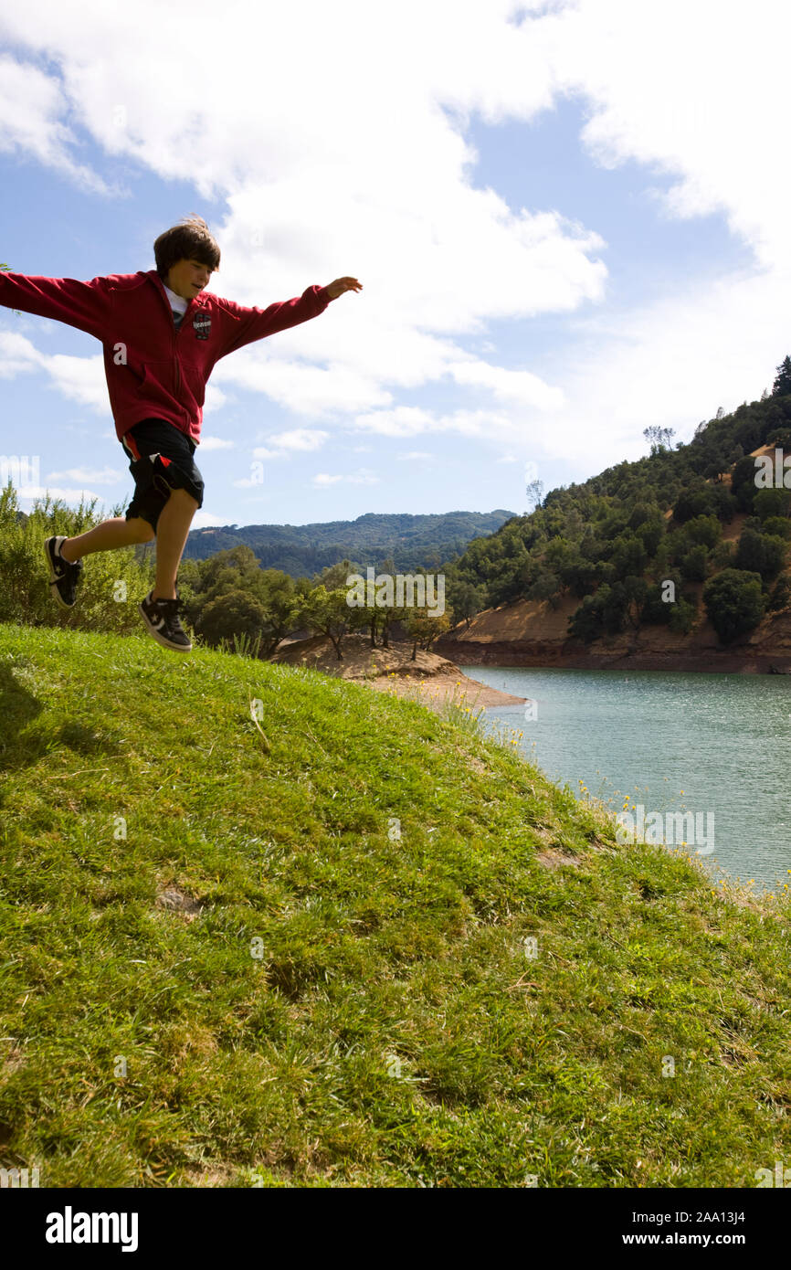 Boys jumping into river hi-res stock photography and images - Alamy