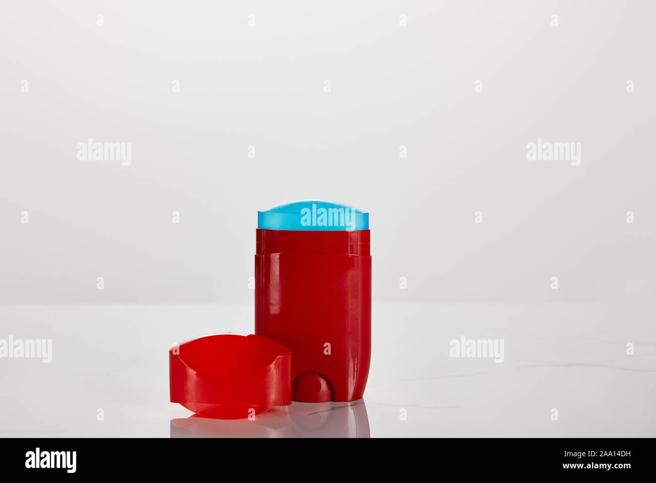 red roll on bottle of deodorant isolated on white Stock Photo - Alamy