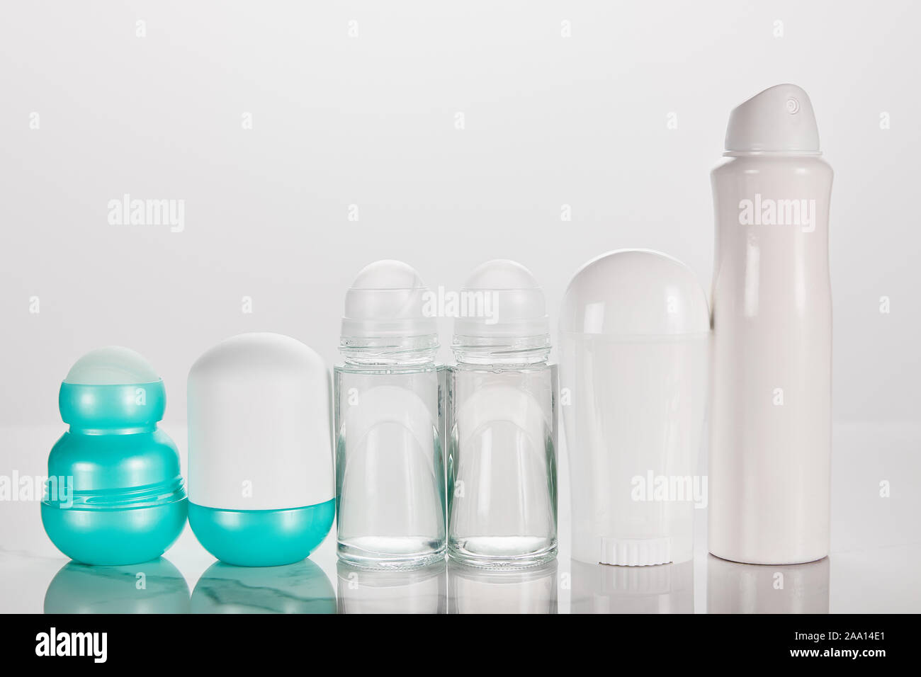 bottles of deodorant isolated on white Stock Photo - Alamy