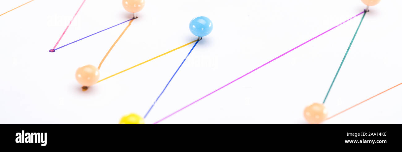 close up view of colorful connected drawn lines with pins, connection ...