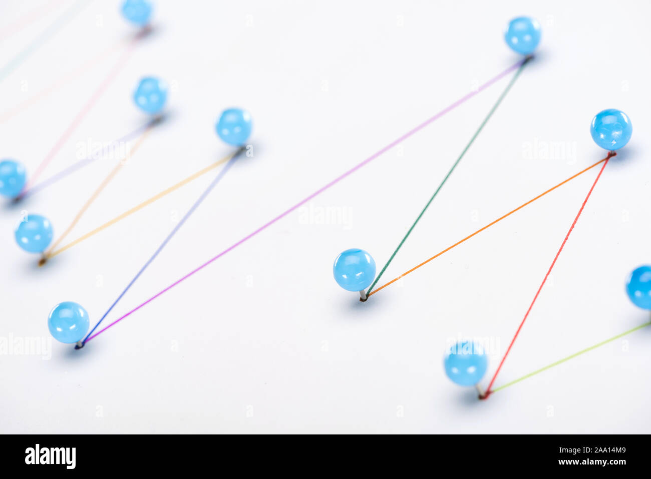 close up view of colorful connected drawn lines with pins, connection ...