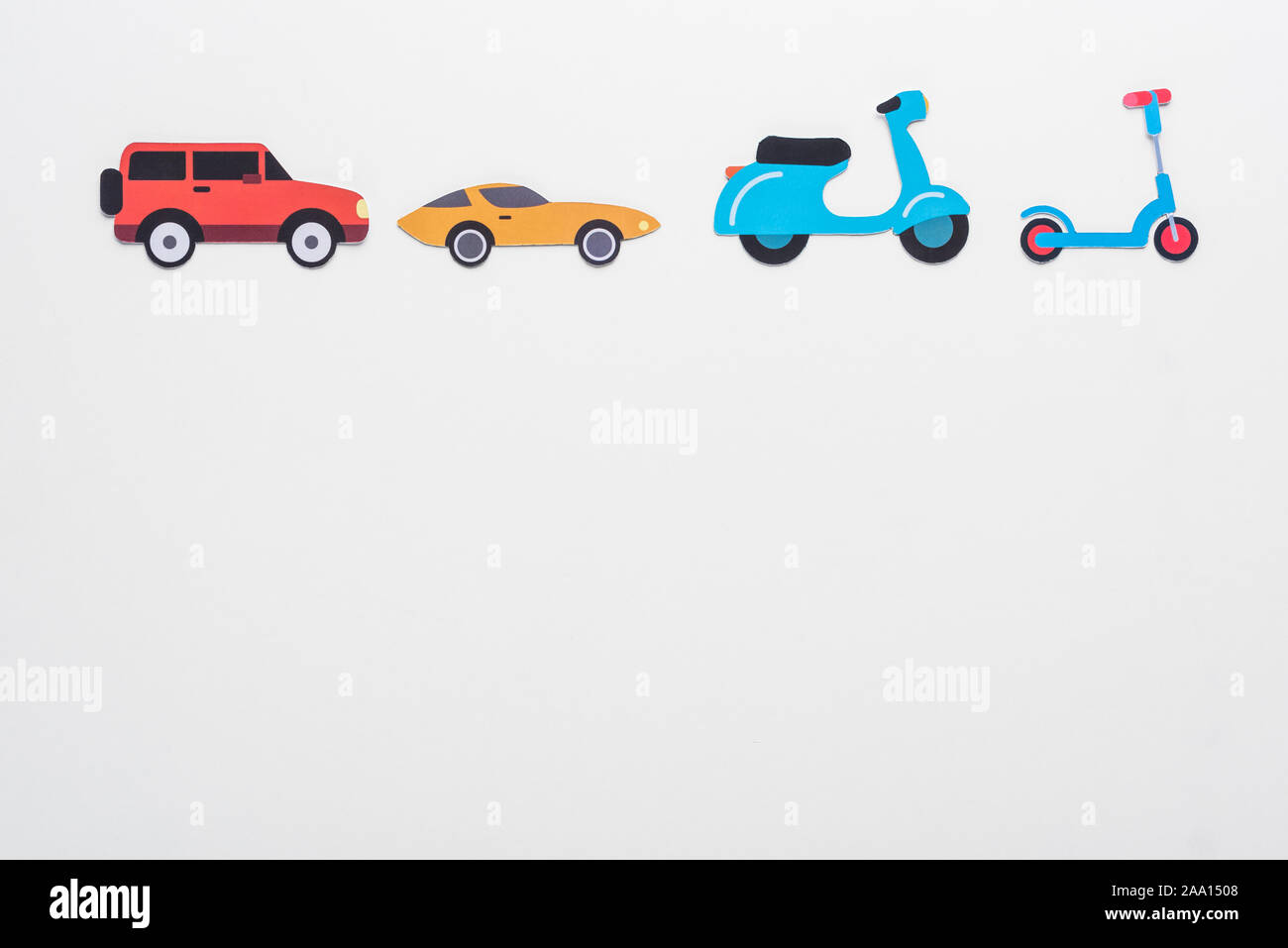 top view of paper cut vehicles on white background with copy space ...