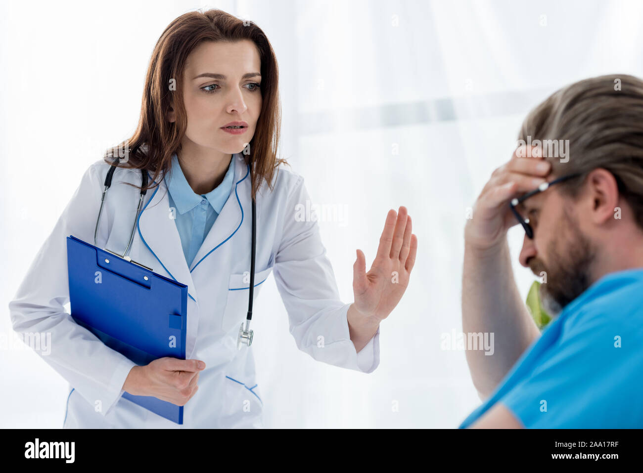 Doctor and shocked patient hi-res stock photography and images - Alamy