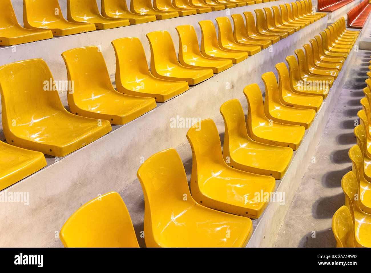 lines of yellow stadium seats Stock Photo - Alamy
