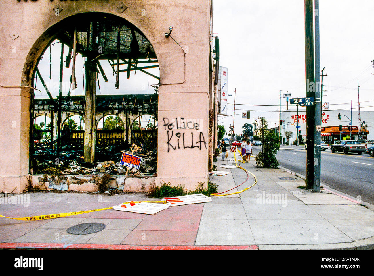 Anti-police graffiti marks a burned-out store in Los Angeles after the ...