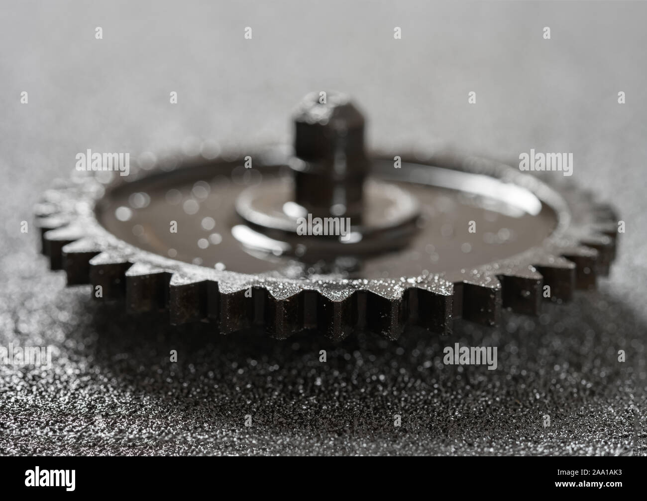 side view cogwheel on dark background Stock Photo - Alamy