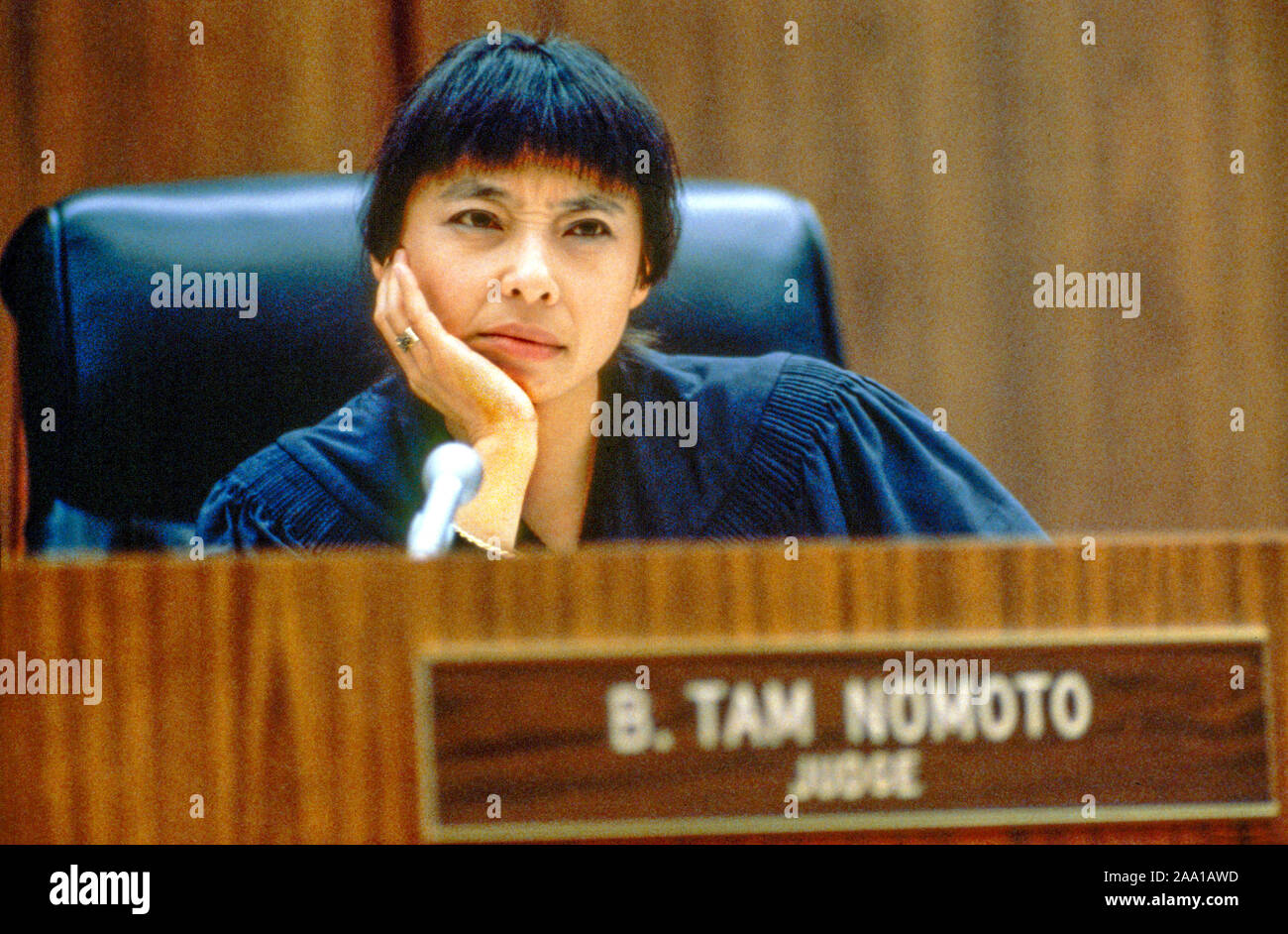 A Japanese American female municipal court judge listens to arguments ...