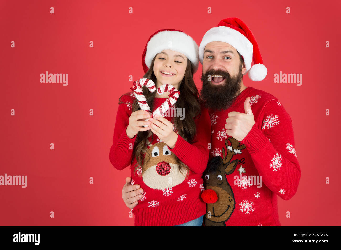 Christmas Carol. Father and daughter with candy canes christmas ...