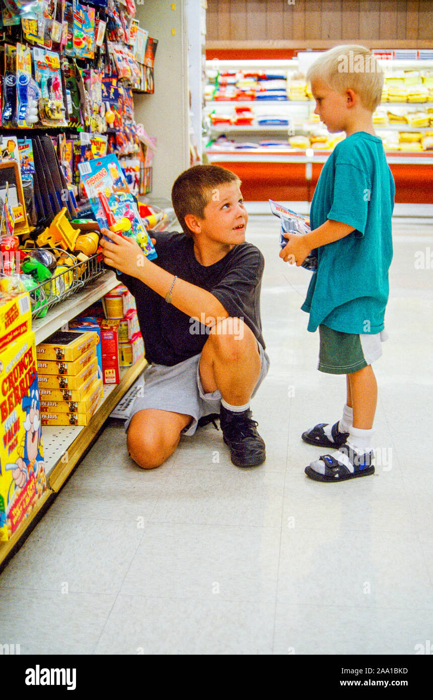 Two brothers shop for toys at a Corona, CA, supermarket. MODEL RELEASE ...