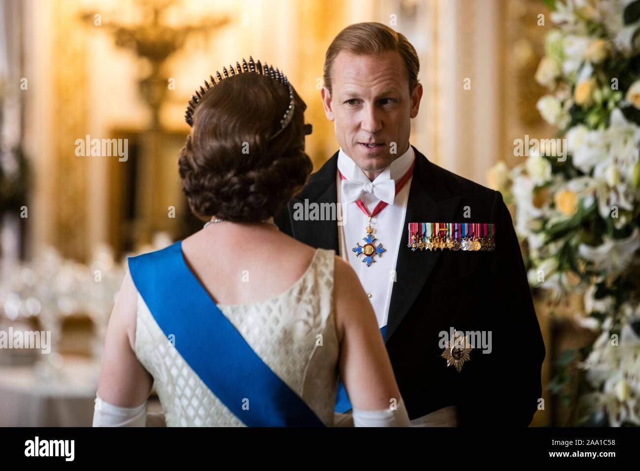 THE CROWN, from left: Olivia Colman (as Queen Elizabeth II, back to ...