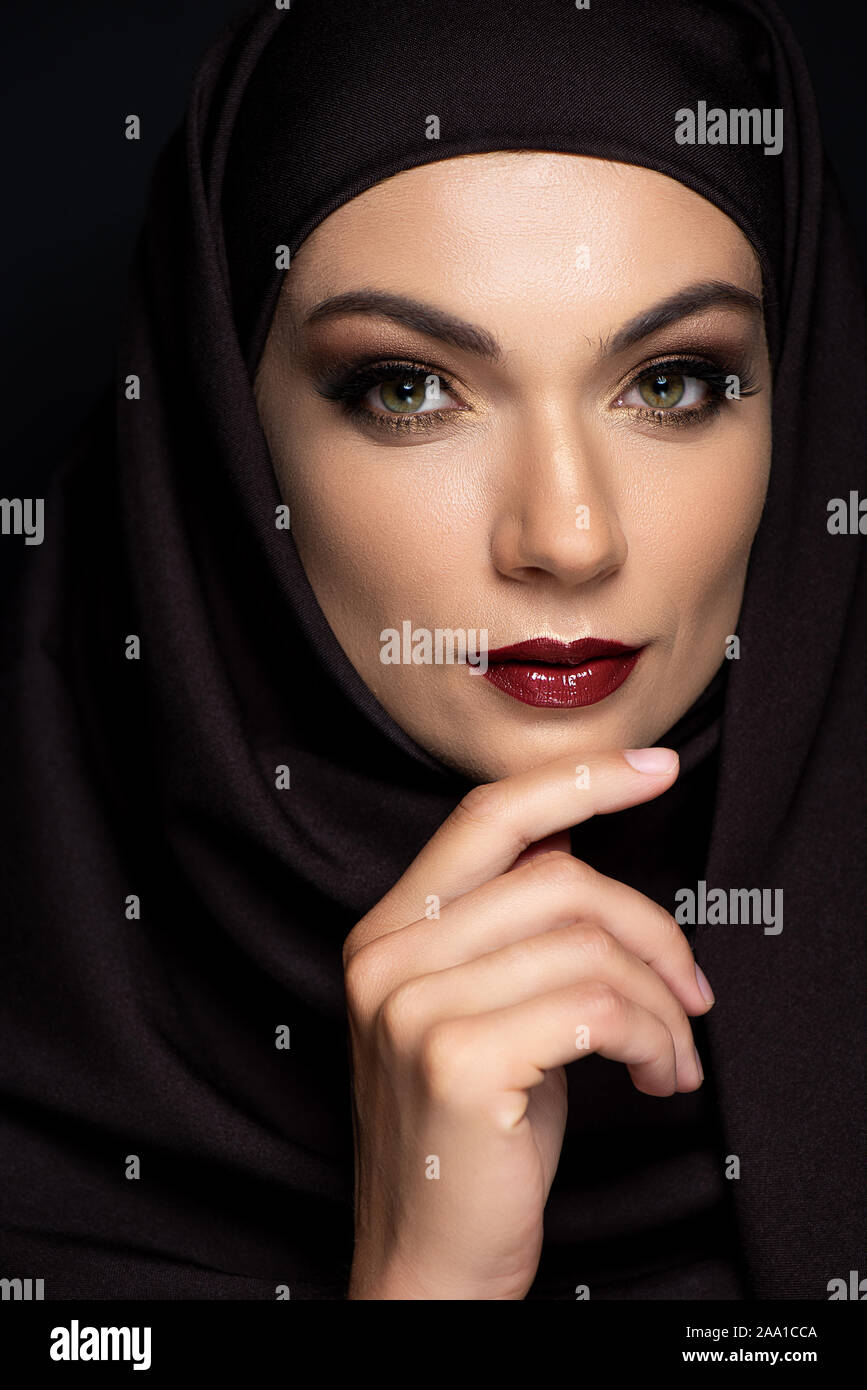 young Muslim woman in hijab with smoky eyes and red lips isolated on ...