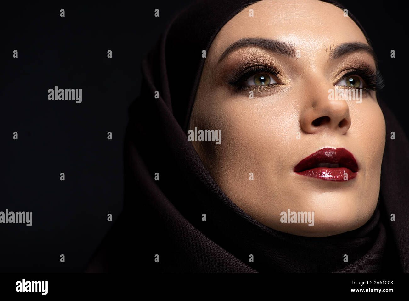 young Muslim woman in hijab with smoky eyes and red lips isolated on ...