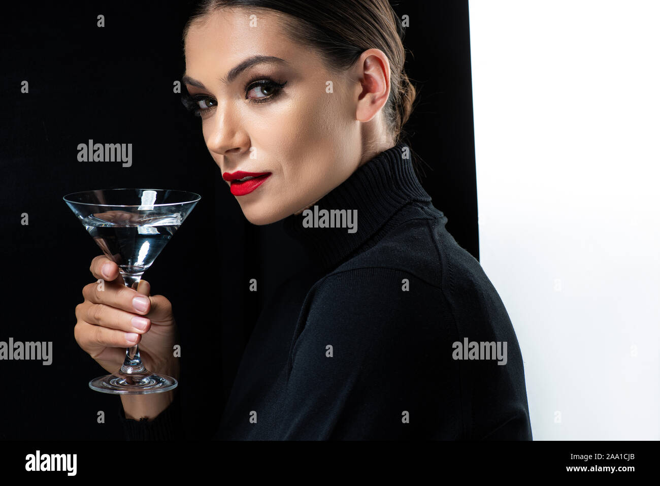 beautiful elegant woman with red lips holding martini isolated on white ...