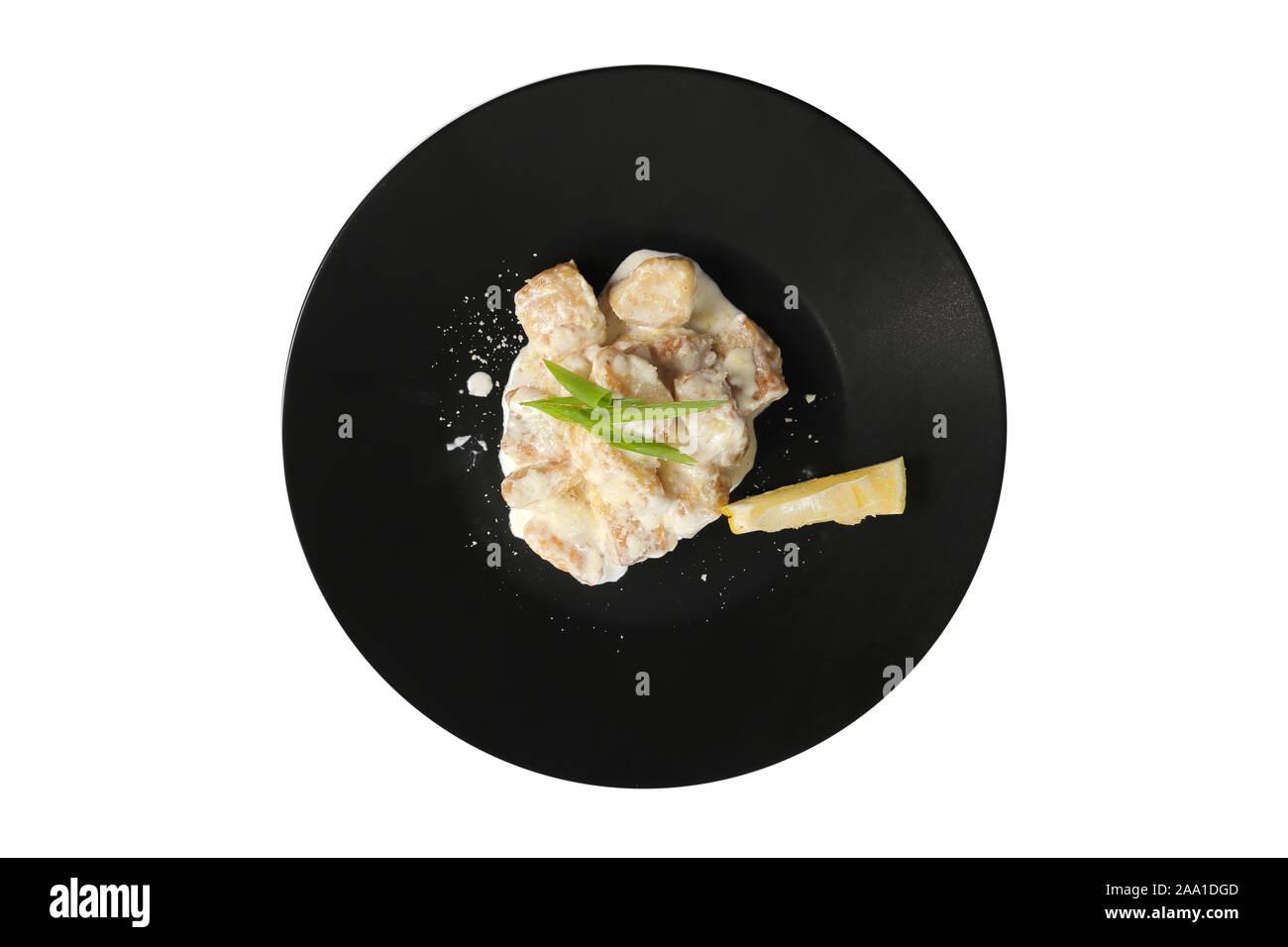 Fried fish fillet on black plate isolated on white background Stock ...