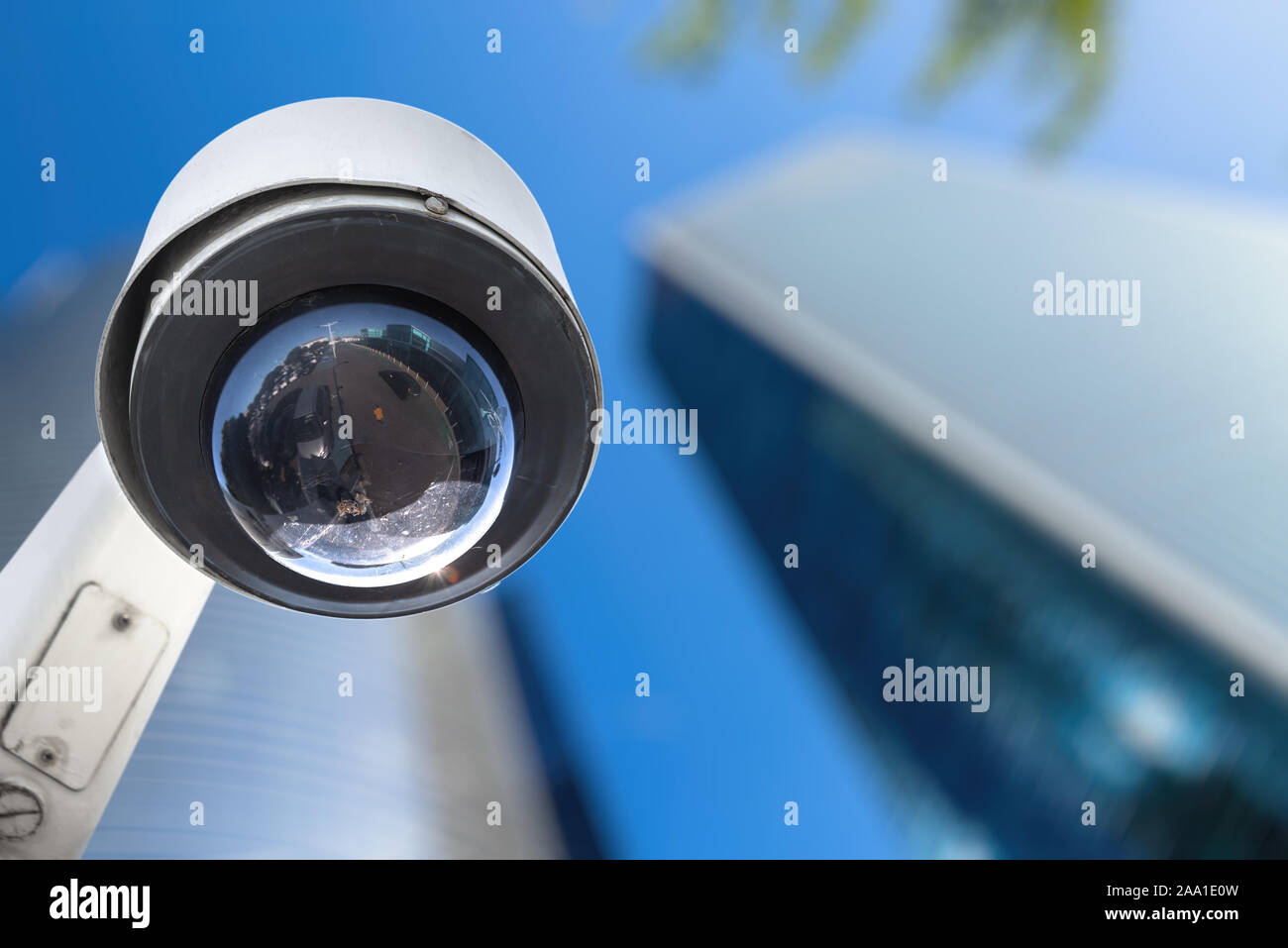CCTV camera concept with blurred business buildings in the background ...
