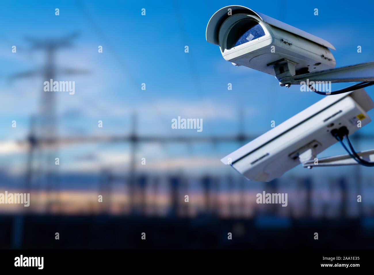 CCTV camera concept with power station on blurry background Stock Photo ...