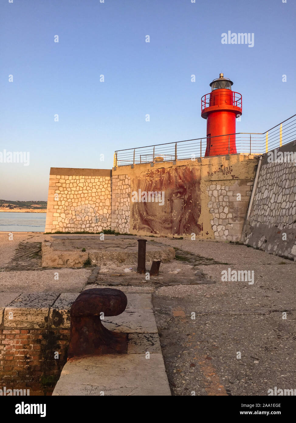 The red light on the pier of Ancona port Stock Photo - Alamy