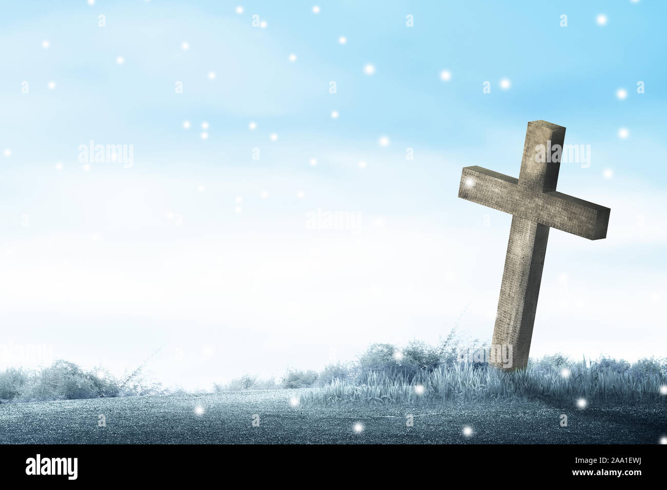Christian cross on the grass with snowfall background Stock Photo - Alamy
