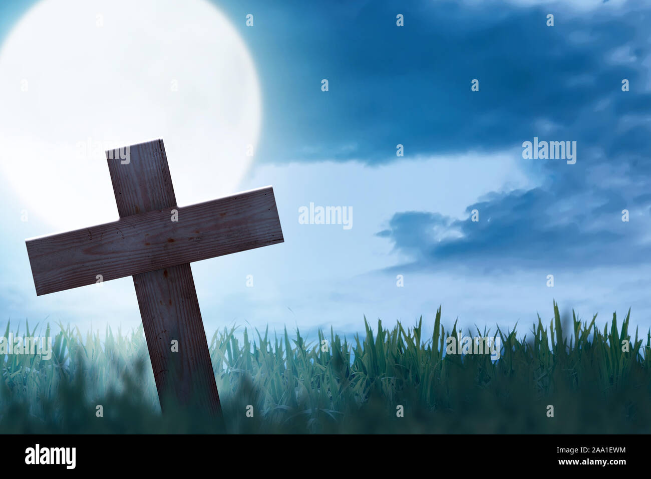 Christian cross on the green grass with moonlight background Stock ...