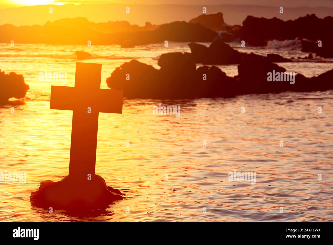 Christian Cross on the beach with a sunset sky background Stock Photo ...