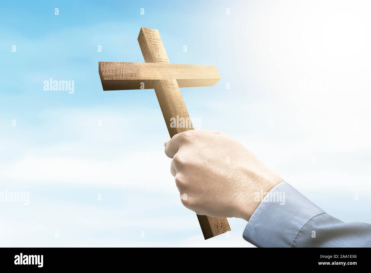 Human hand holding Christian cross with sunlight background Stock Photo ...