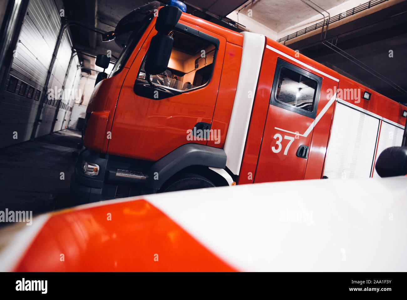 Garage full of fire trucks and vehicles for fast response at the fire ...