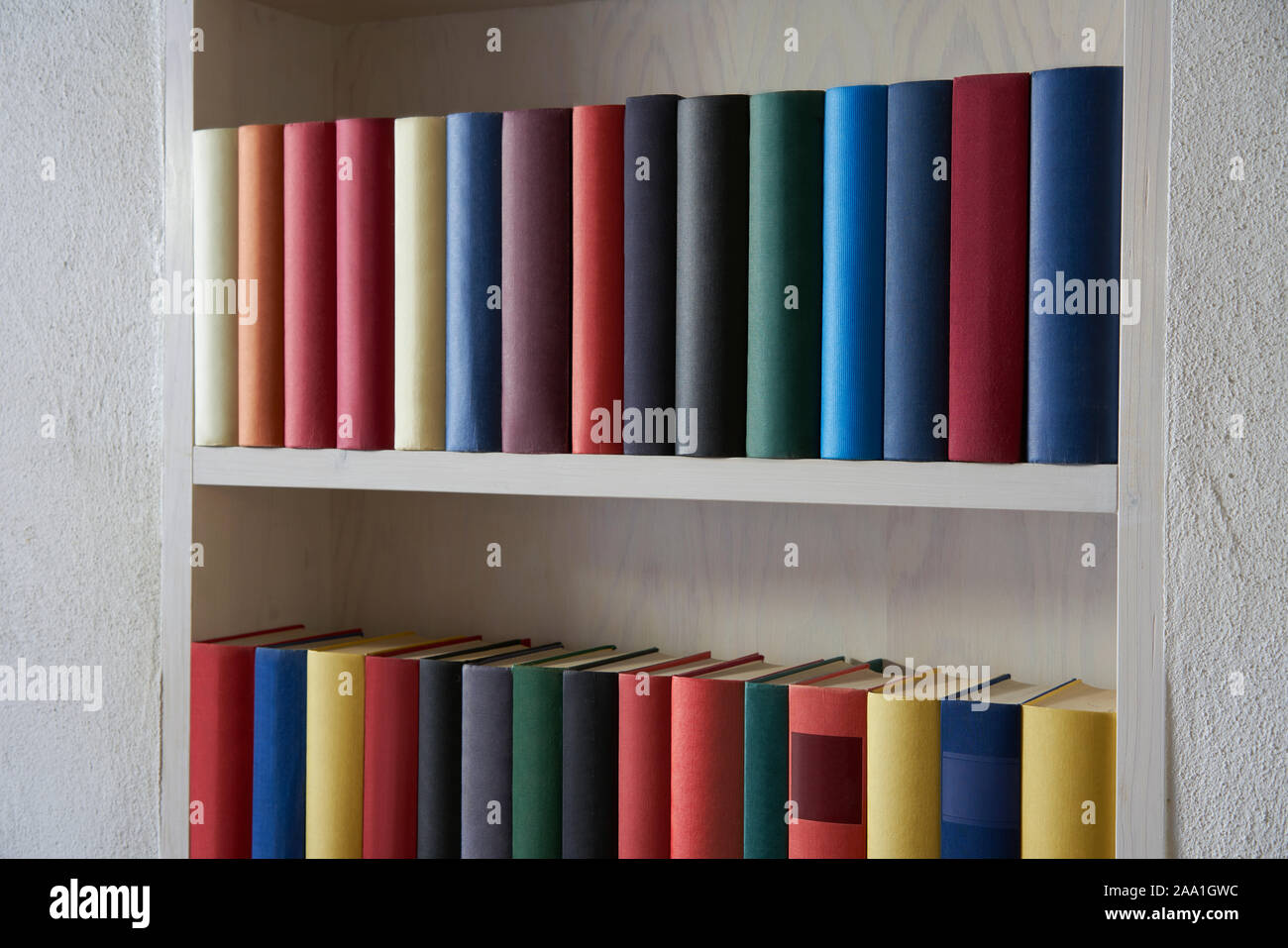 Detail of various colorful books in a shelf, sideview Stock Photo - Alamy