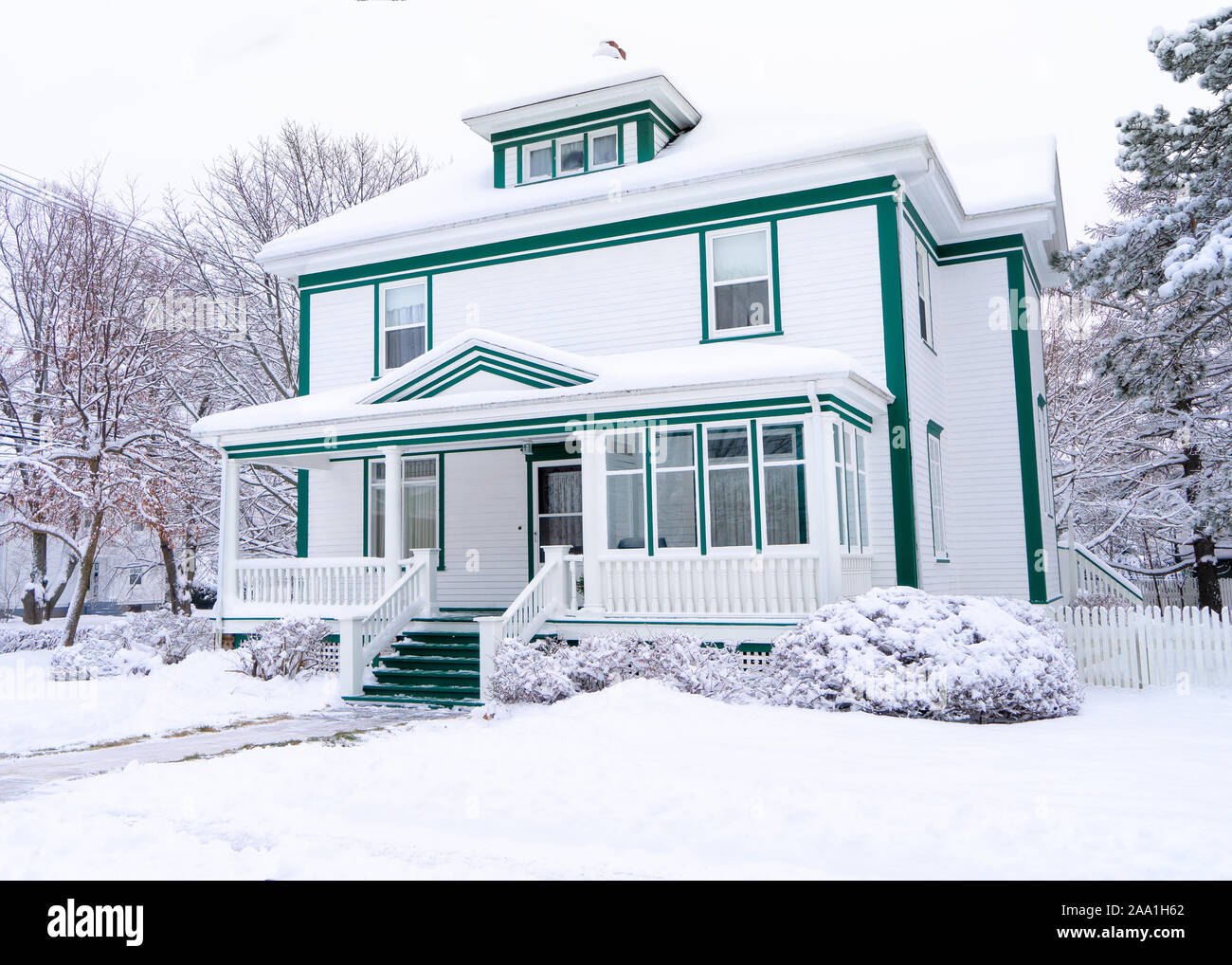 Older traditional style home after a snowfall Stock Photo - Alamy