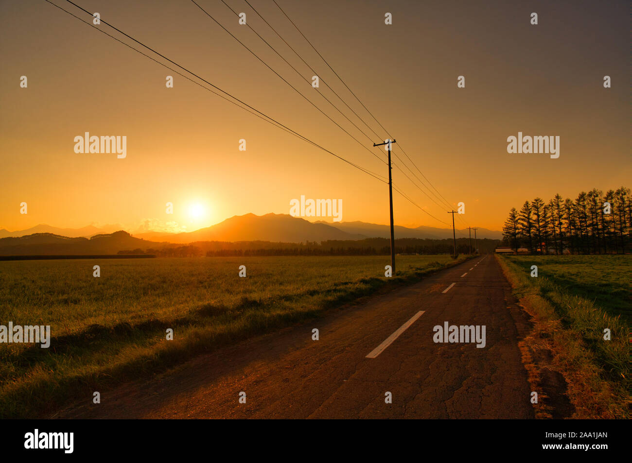 Sunset and road Stock Photo - Alamy