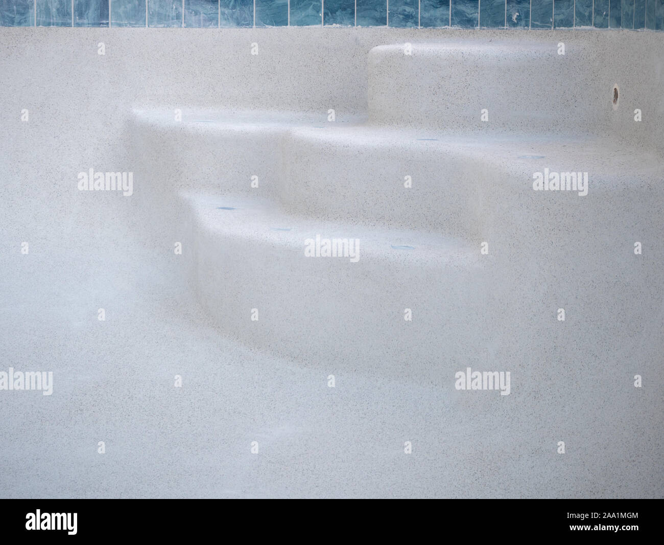 Curved white textured steps in an empty unfilled swimming pool Stock ...