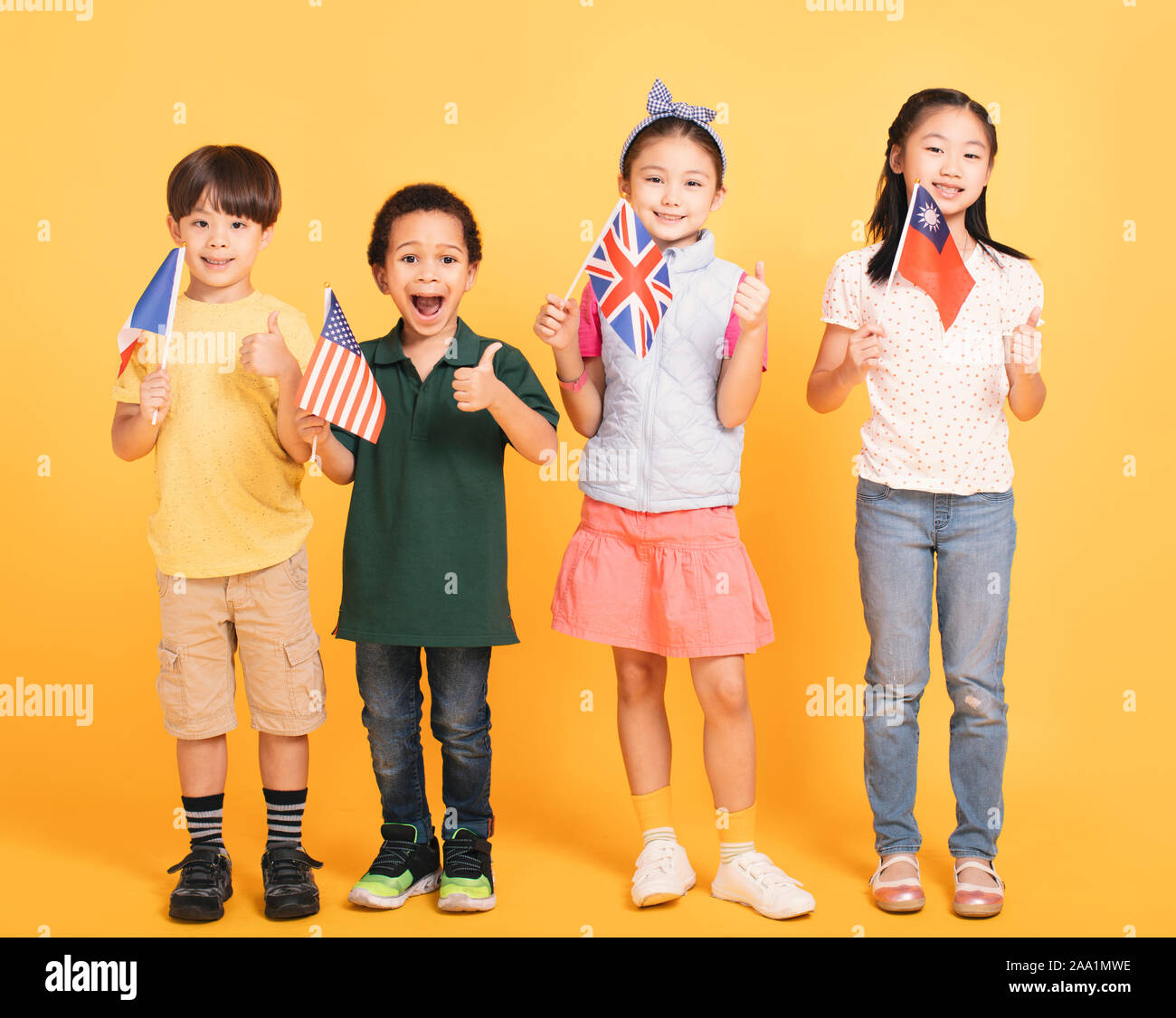 Group of happy kids showing the flags Stock Photo - Alamy