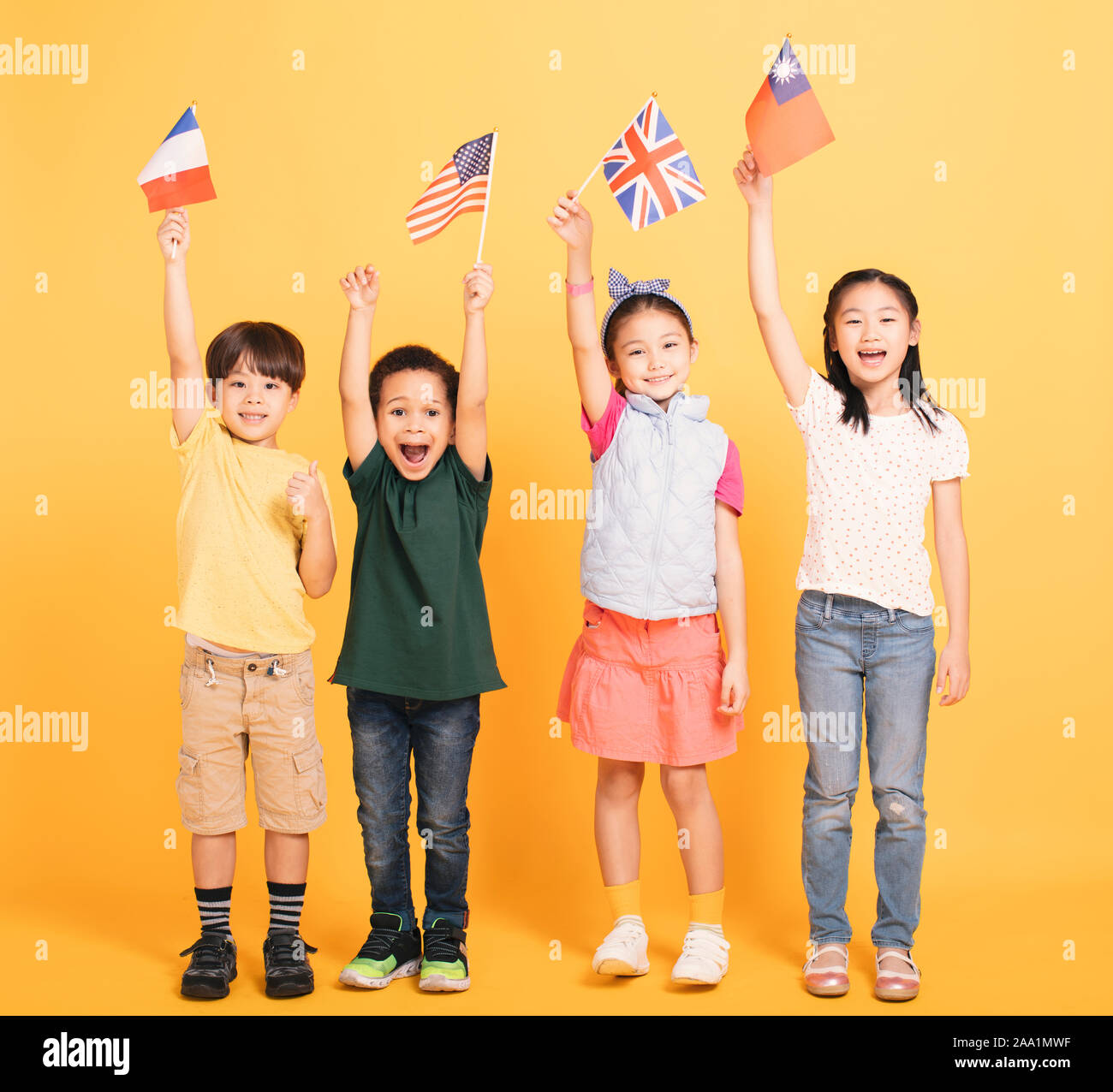 Group of happy kids showing the flags Stock Photo - Alamy